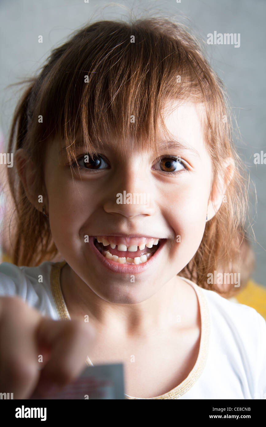 Cheerful little girl smile. White isolated Stock Photo - Alamy