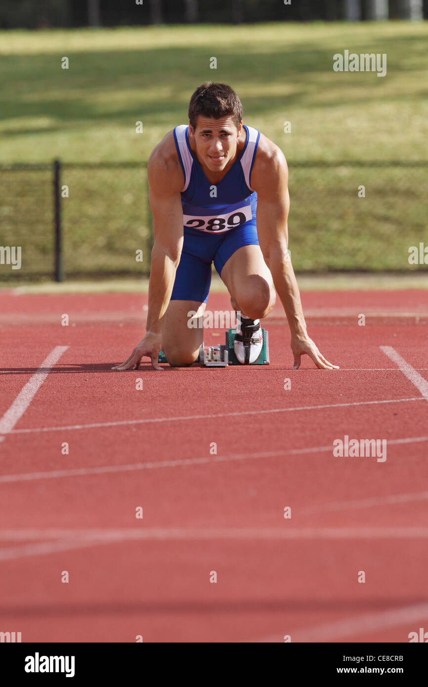 Runner Preparing To Start Stock Photo - Alamy