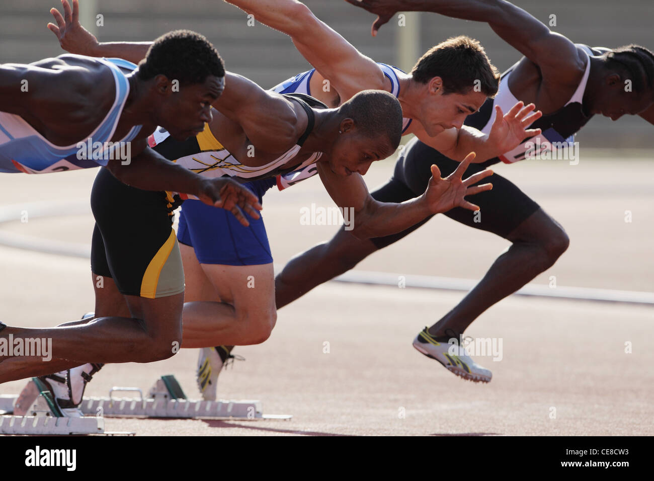 Runners Taking Off From Starting Point Stock Photo - Alamy