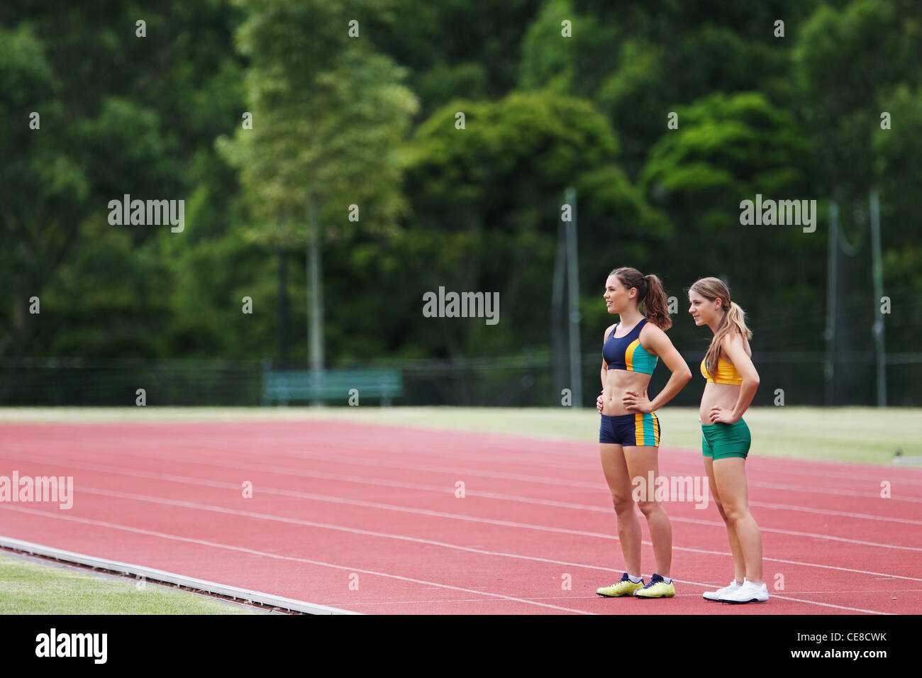Two Female Runners On Race Track Stock Photo - Alamy