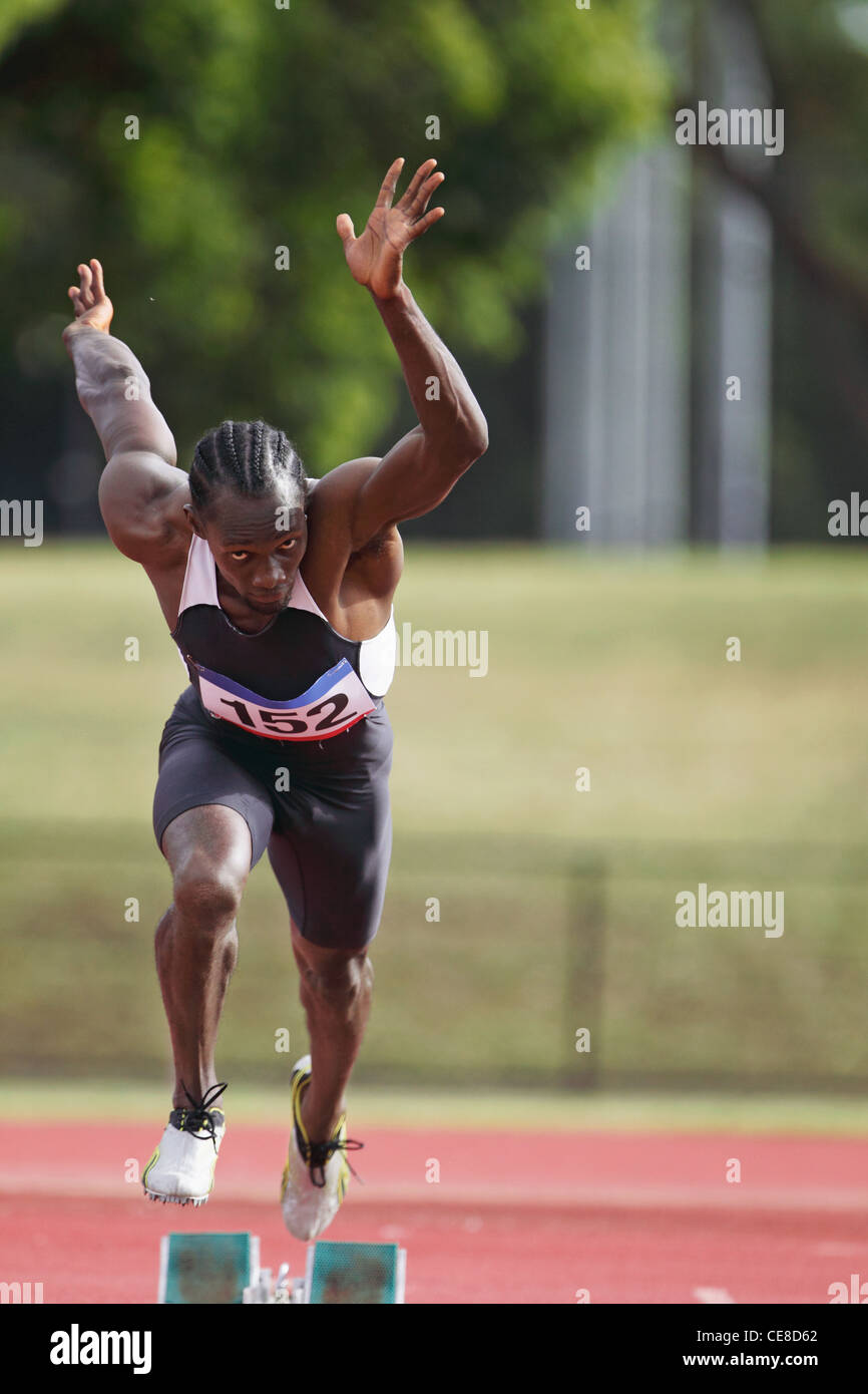 Athlete Sprinting From Starting Blocks Stock Photo - Alamy