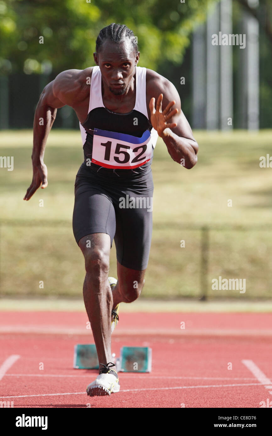 Athlete Running Away From Starting Blocks Stock Photo - Alamy