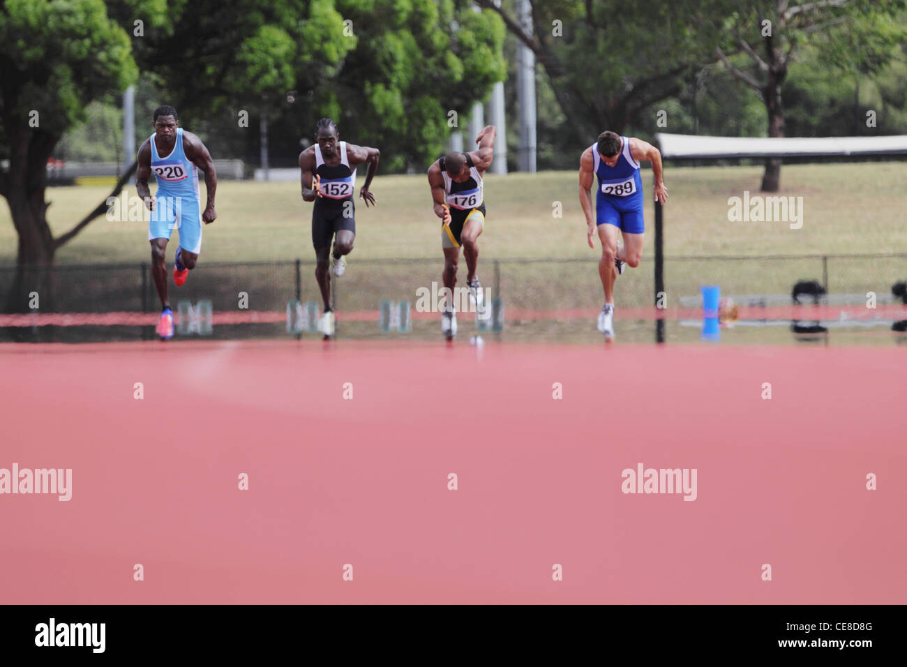 Males running on track hi-res stock photography and images - Alamy