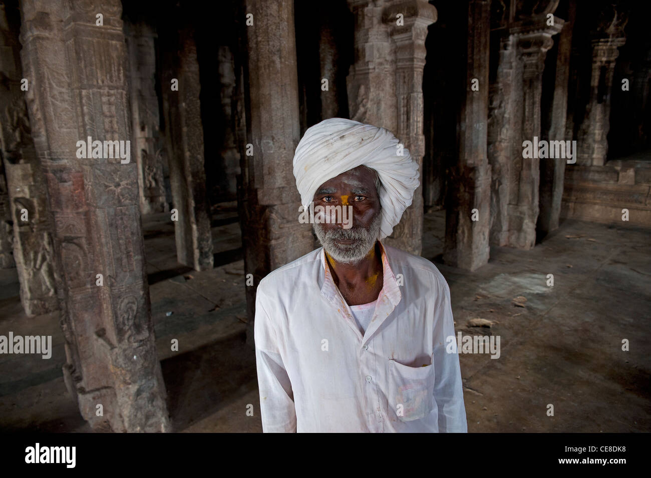 Pilgrim inside temple in hampi hi-res stock photography and images - Alamy