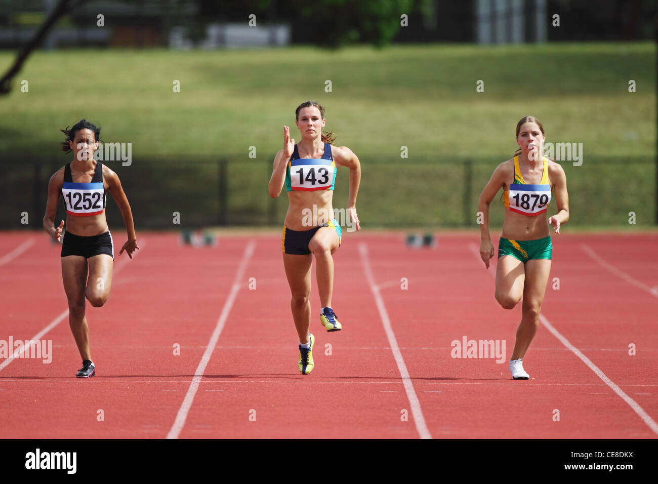 Female Runners On Racetrack Stock Photo - Alamy