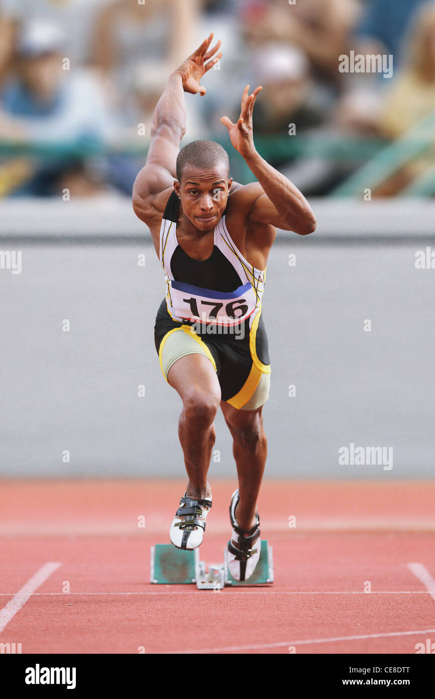 Athlete Sprinting From Starting Blocks Stock Photo - Alamy