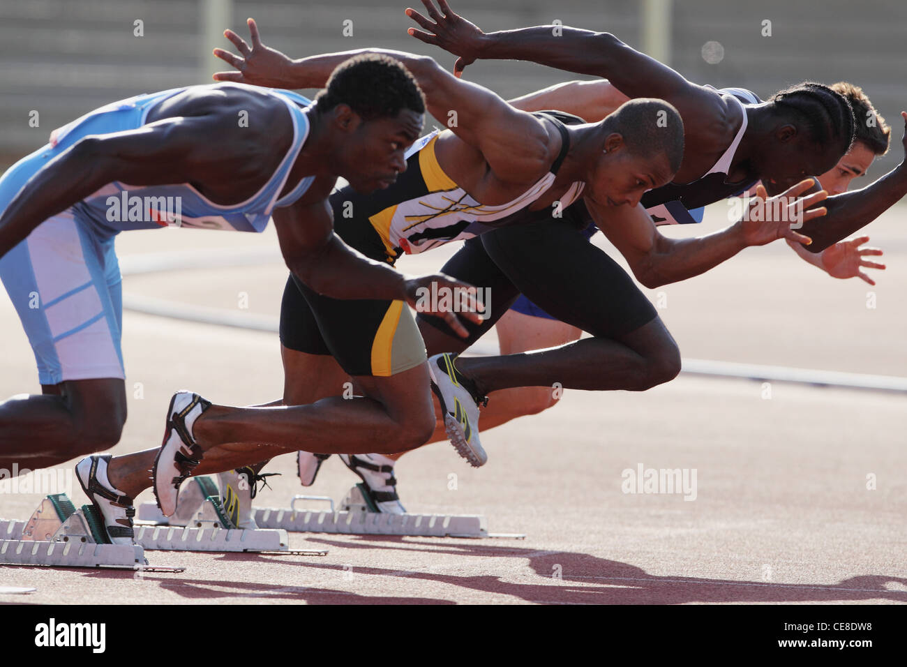 Runners Taking Off From Starting Point Stock Photo - Alamy