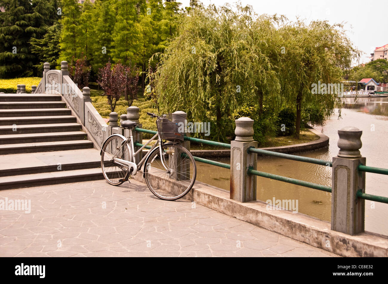 Bicycle ride along a canal in Shanghai Pudong, China Stock Photo - Alamy