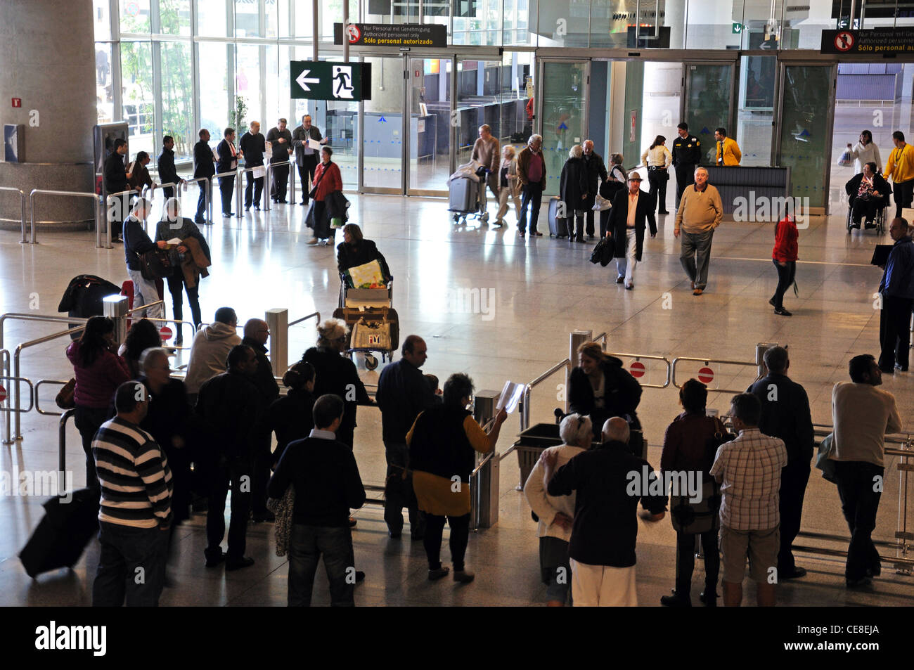 People waiting for passengers in the arrivals hall, Terminal 3, Malaga ...