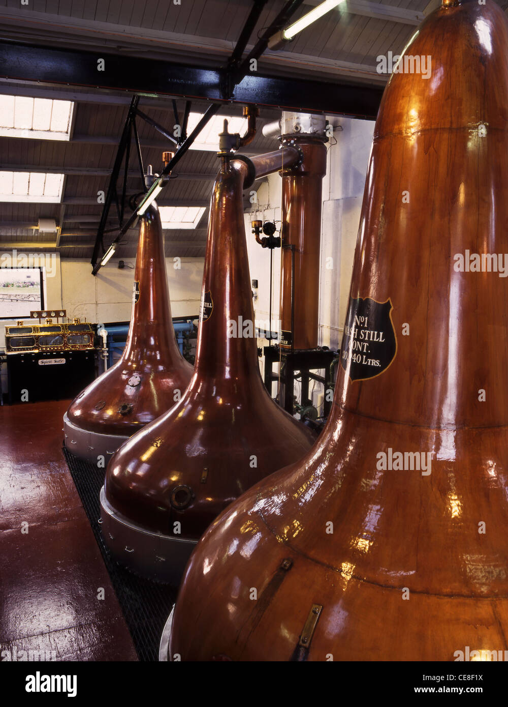 Stills in a malt whisky distillery stillhouse Stock Photo - Alamy