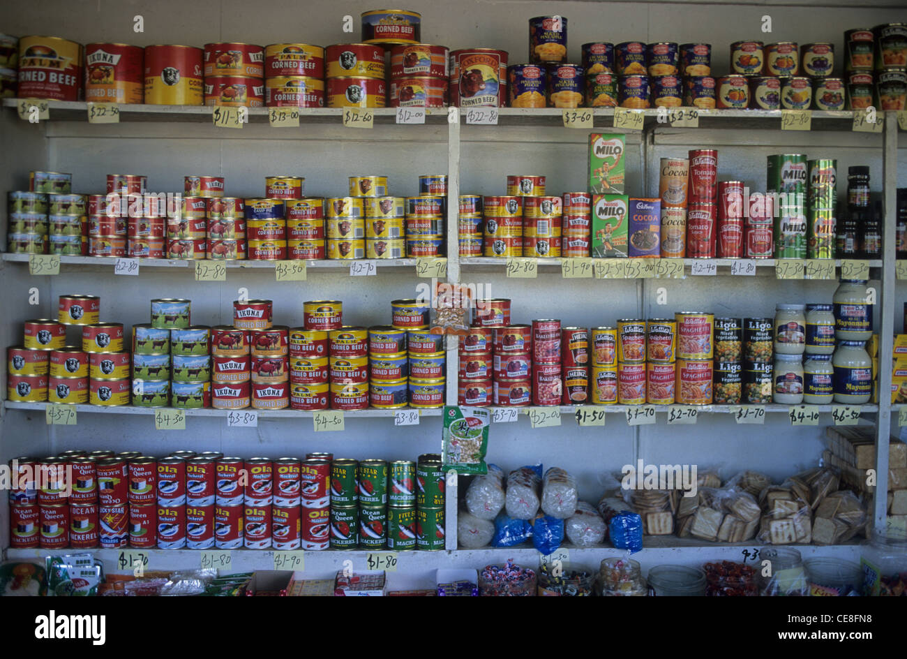 Tins of food stacked up on shelves in a shop, Melbourne, Australia ...