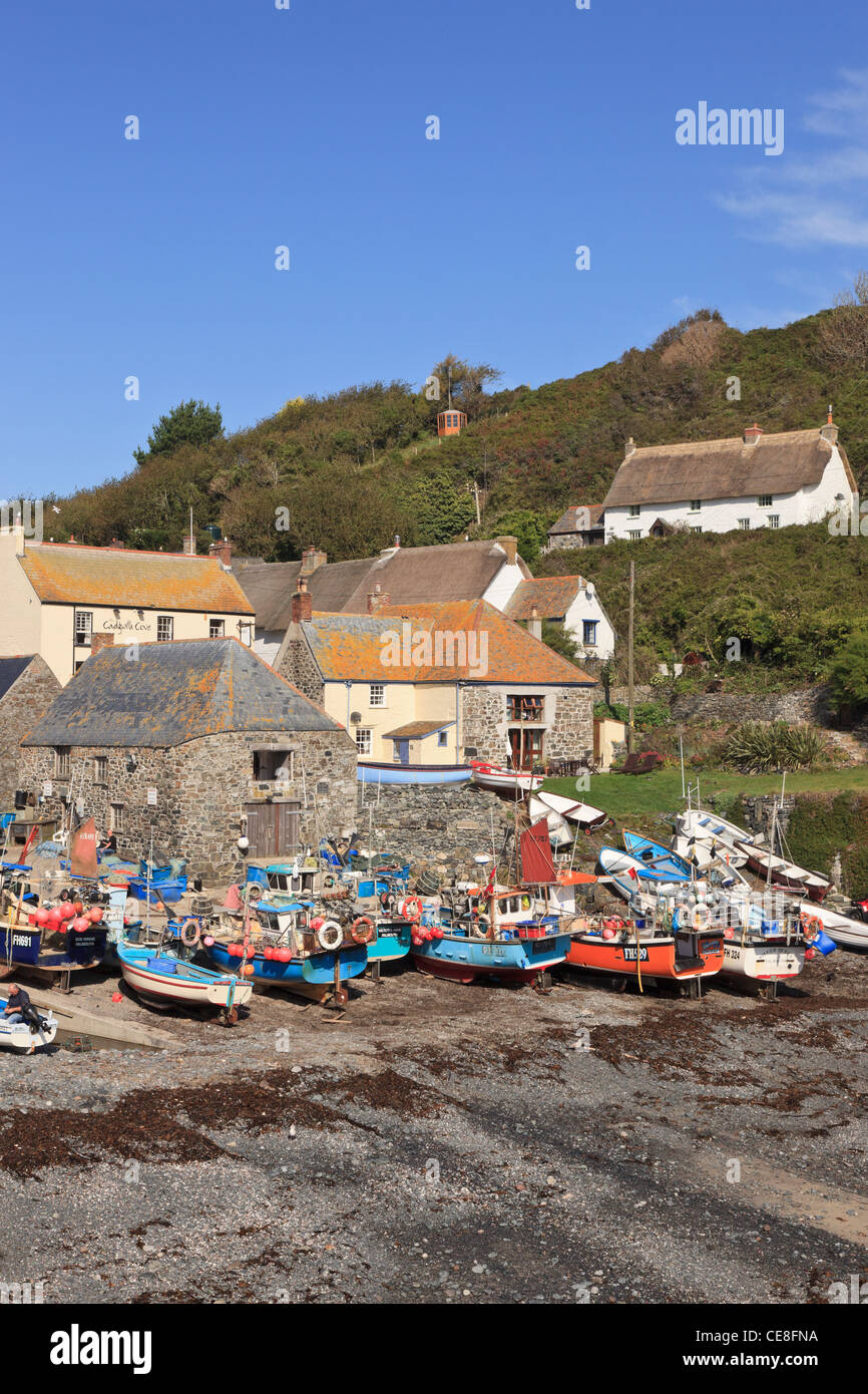Old fishing village with boats beached on shore in the small harbour at ...