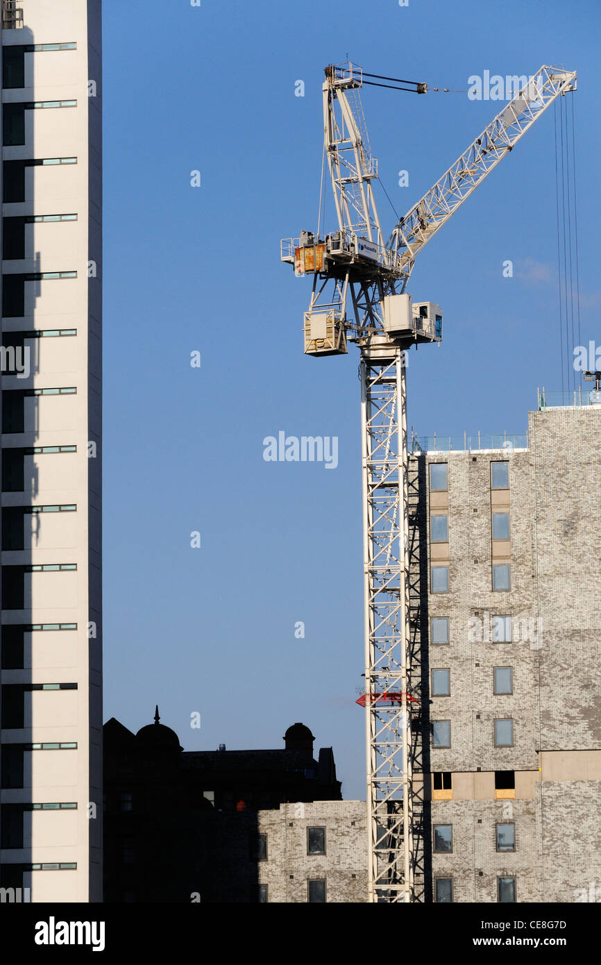 Tower crane working on a high rise building Stock Photo - Alamy