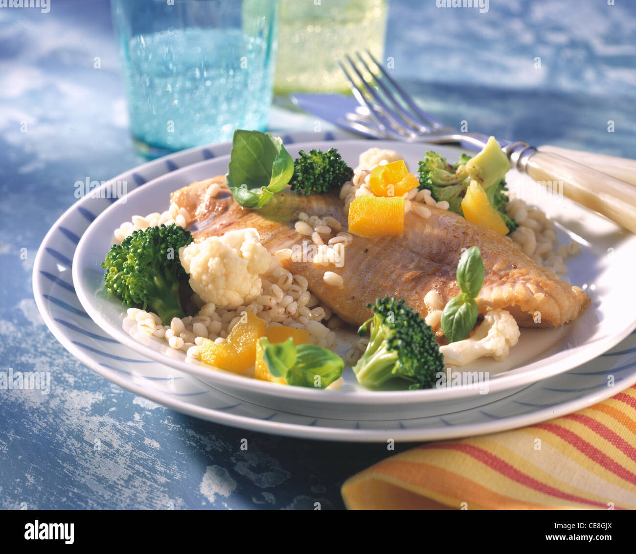 Brook trout filet with vegetable and barley Stock Photo - Alamy