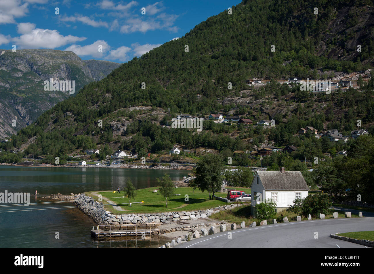 Eidfjord Norway view of road houses fjord mountain background with ...