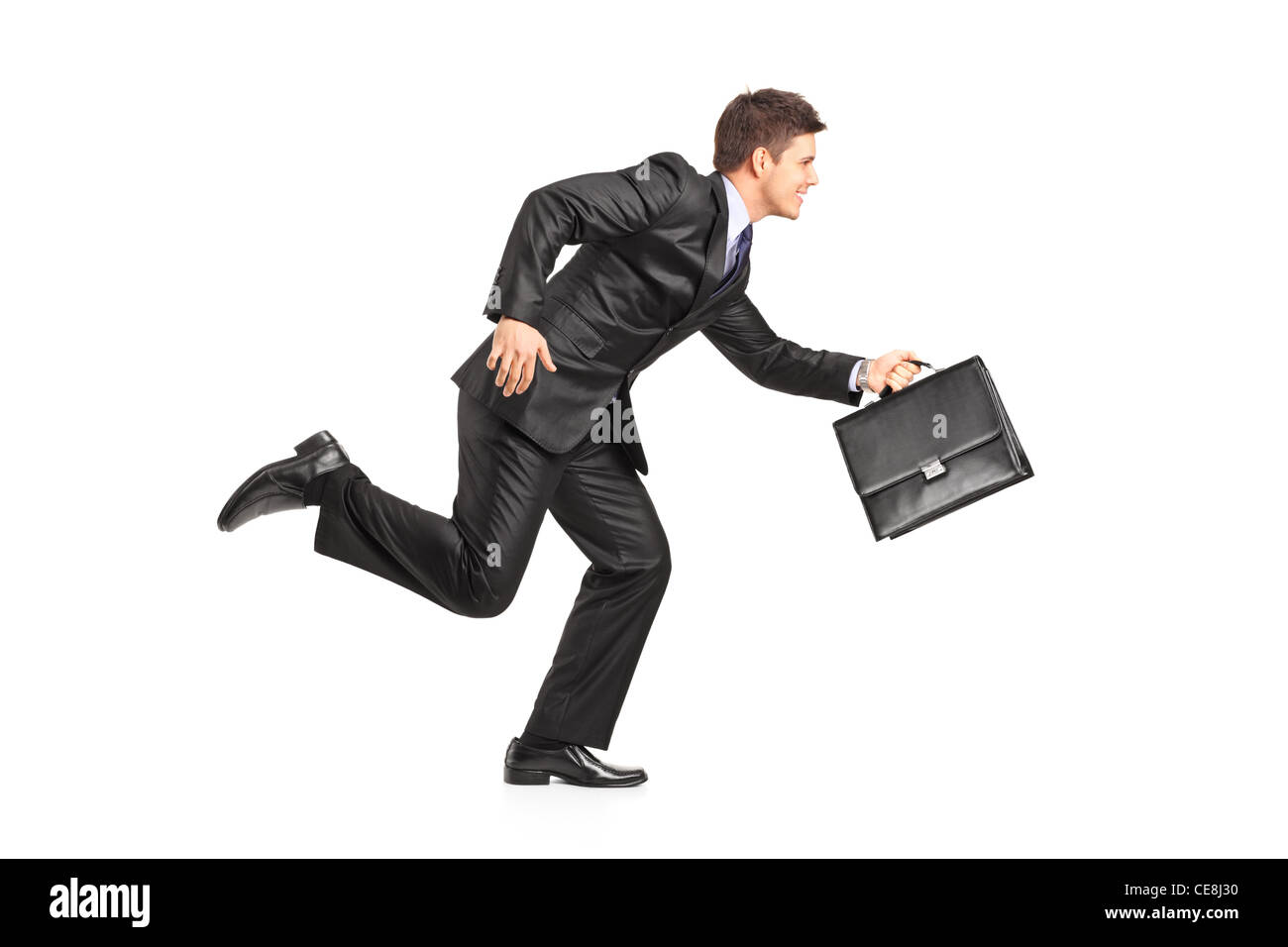 Businessman running with a briefcase Stock Photo - Alamy