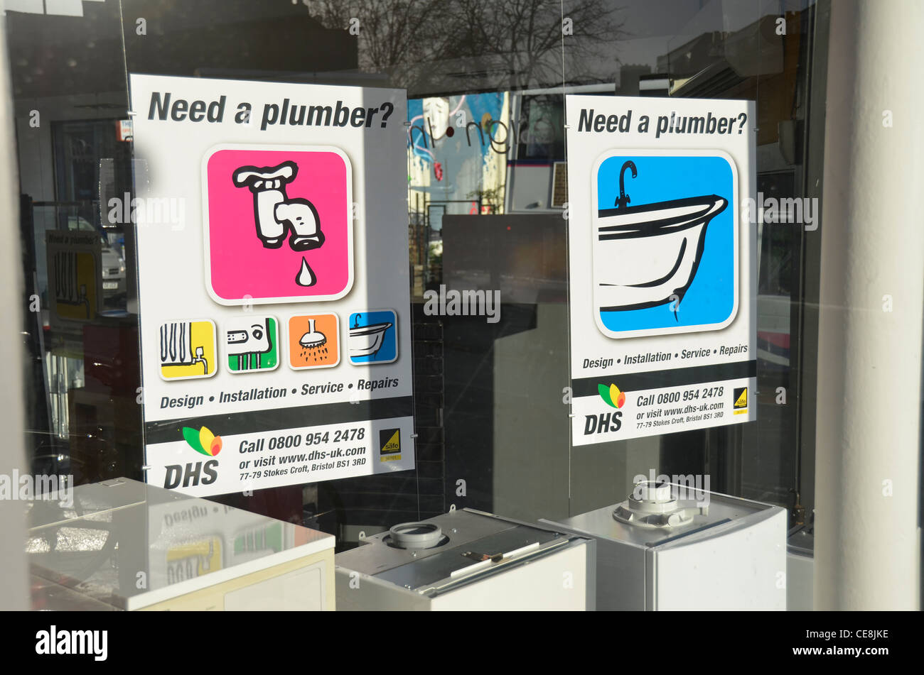 Plumber shop window, posters, Bristol, England, UK Stock Photo - Alamy