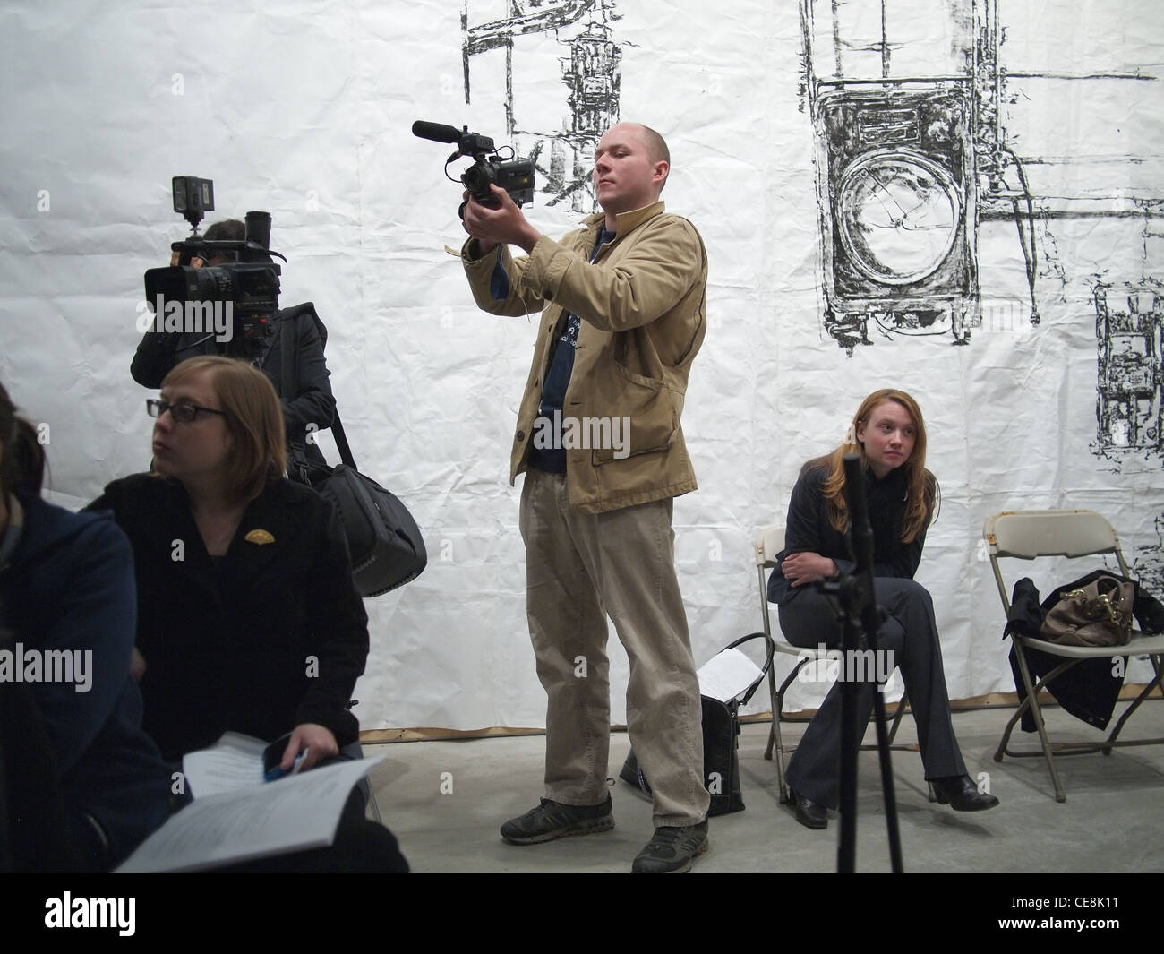 Videographer taping a political meeting, Brooklyn, New York Stock Photo ...