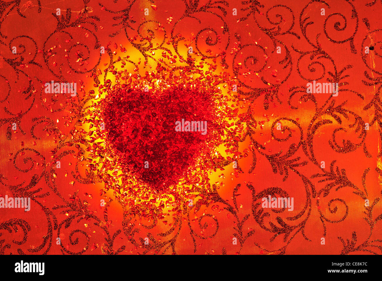The Hot red Heart from glass parts on an red ornament background Stock ...