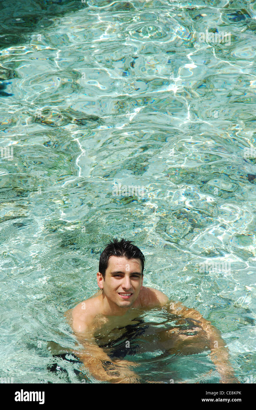 Young man relaxing and smiling in Maldives Stock Photo - Alamy