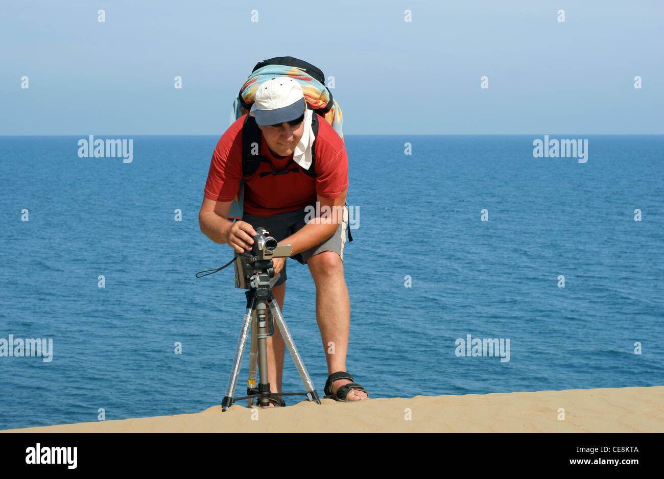 taking video man make movie, sea and beach Stock Photo - Alamy