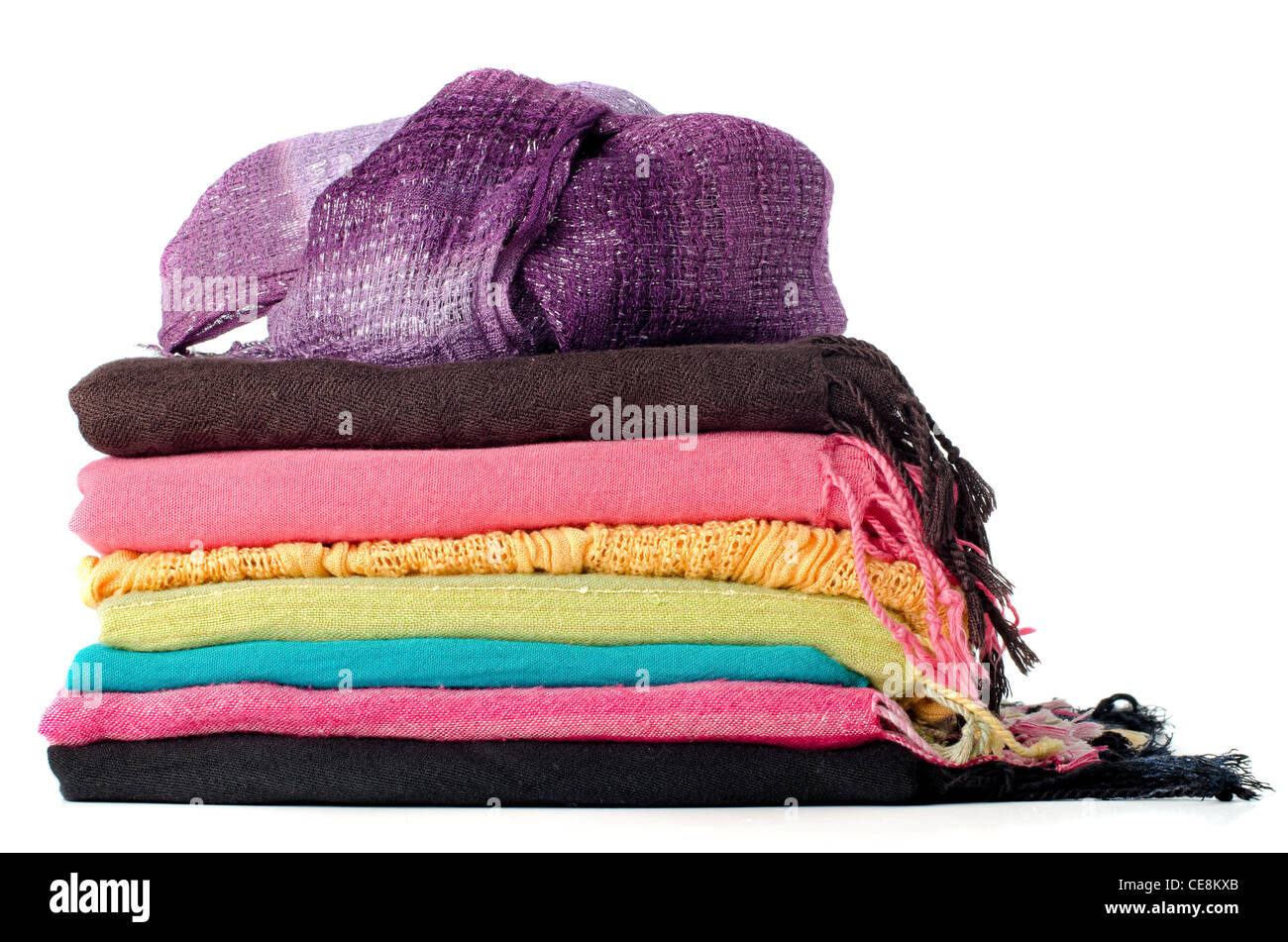 Pile of colorful scarves over white background Stock Photo - Alamy
