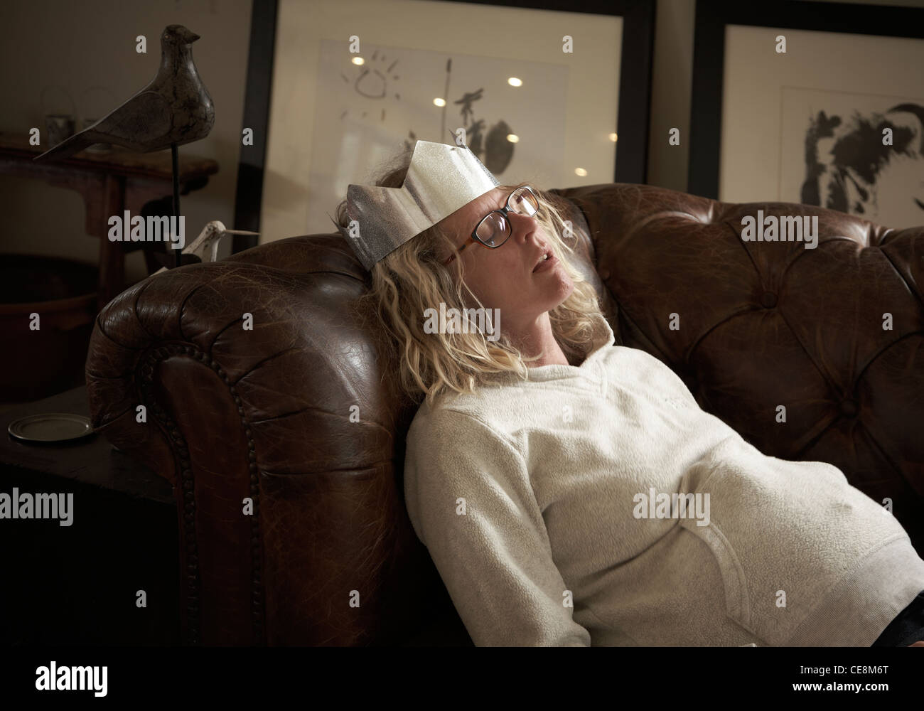 Woman resting after christmas dinner Stock Photo - Alamy