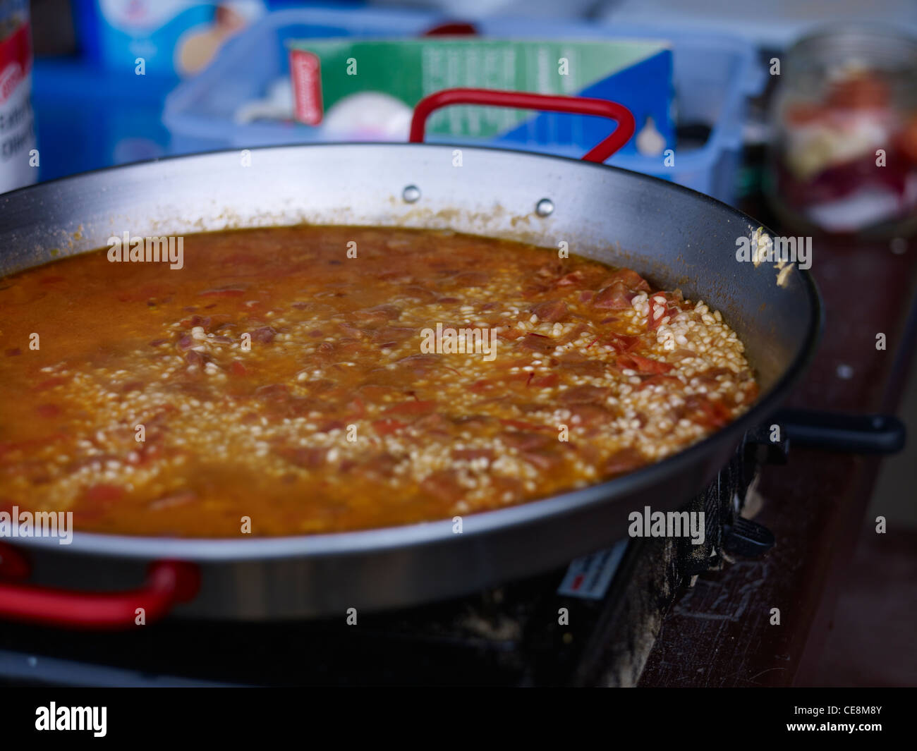 paella dish cooking with calasparra rice Stock Photo - Alamy