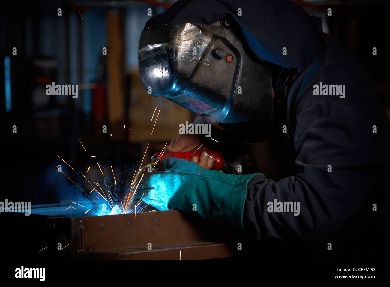 man welding in workshop Stock Photo - Alamy