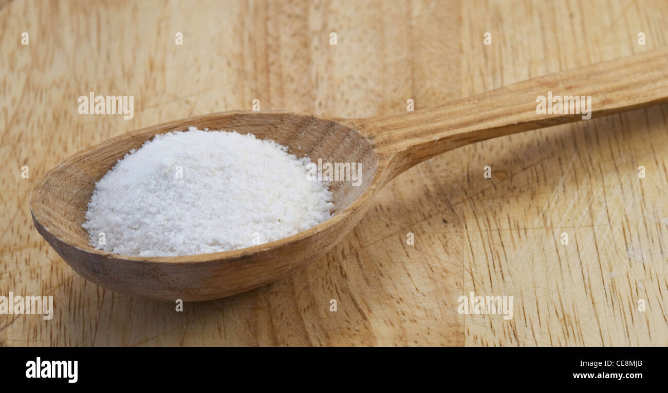 salt in a wooden spoon. Close up Stock Photo - Alamy