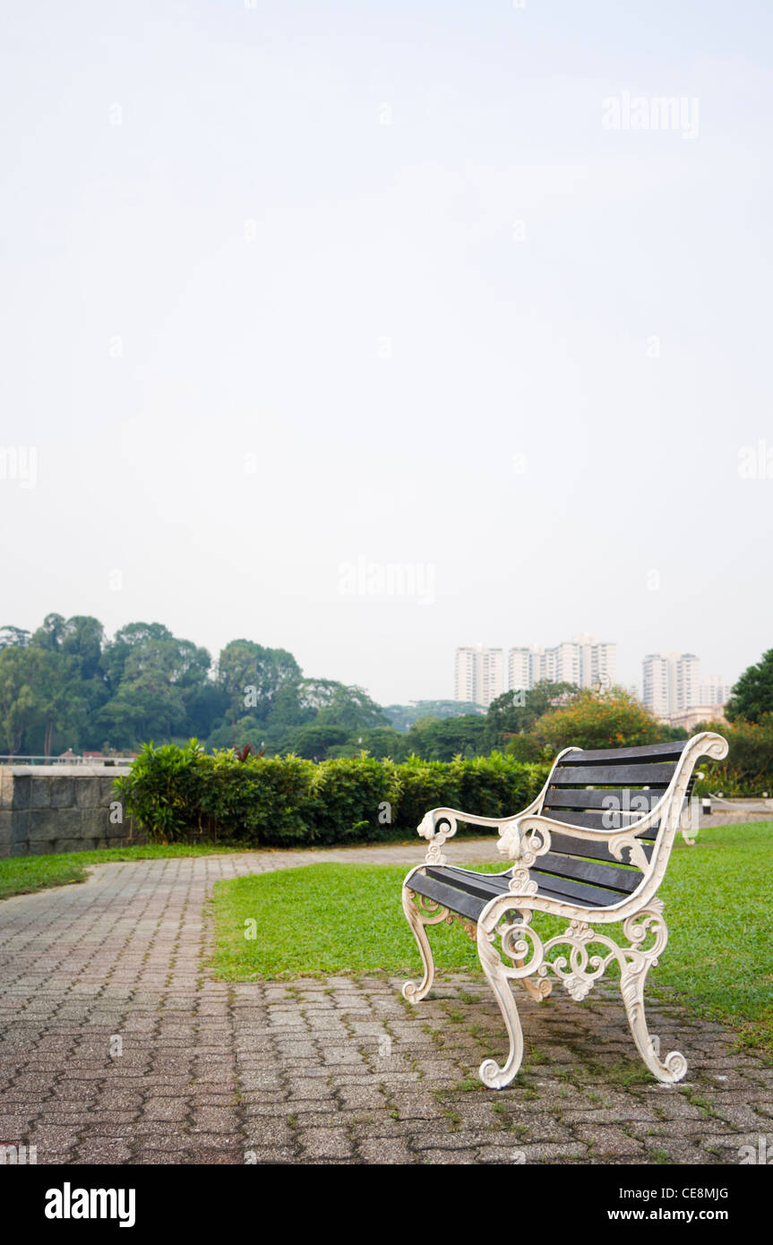 Empty bench in a park, to convey a feeling of waiting or expecting for ...