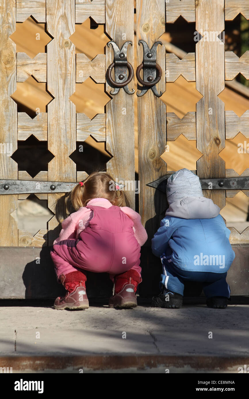Child peeking through the door hi-res stock photography and images - Alamy