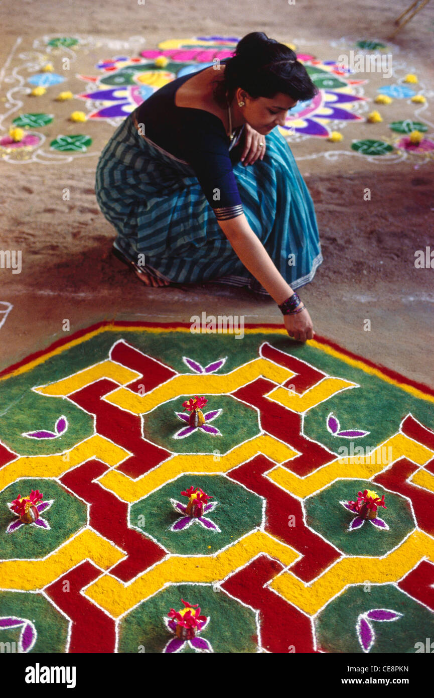 Indian woman making pattern of Rangoli India - Model Released Stock ...