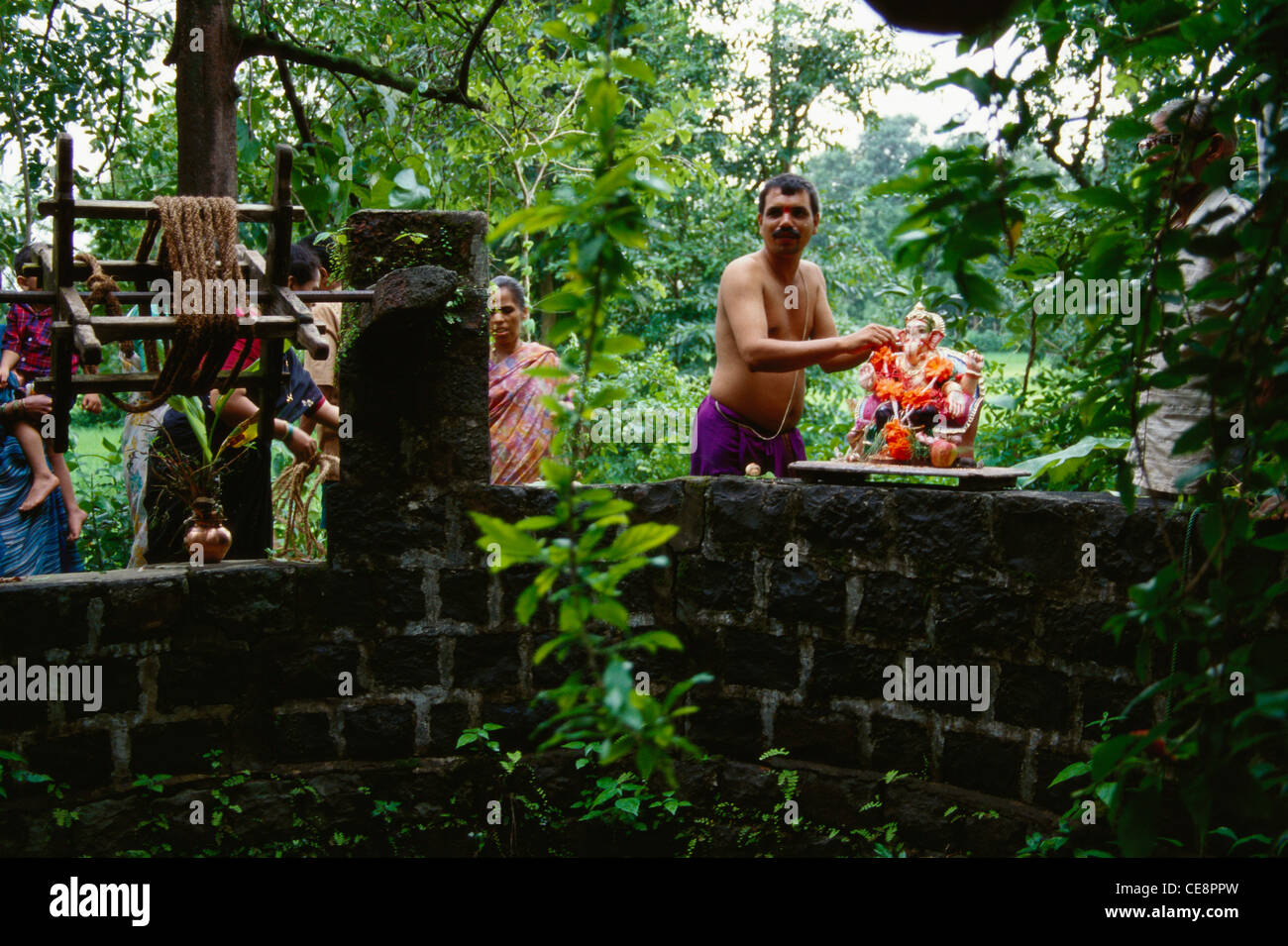 AAD 81358 : indian god Ganesh Festival Lord immersion in well konkan ...