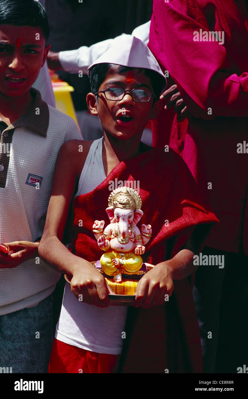 SSK 81428 : indian boy holding statue of Ganesh ganpati Festival ...