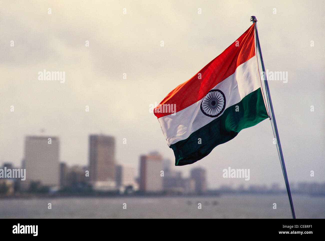 Indian flag flying ; bombay skyline ; bombay ; mumbai ; maharashtra ...