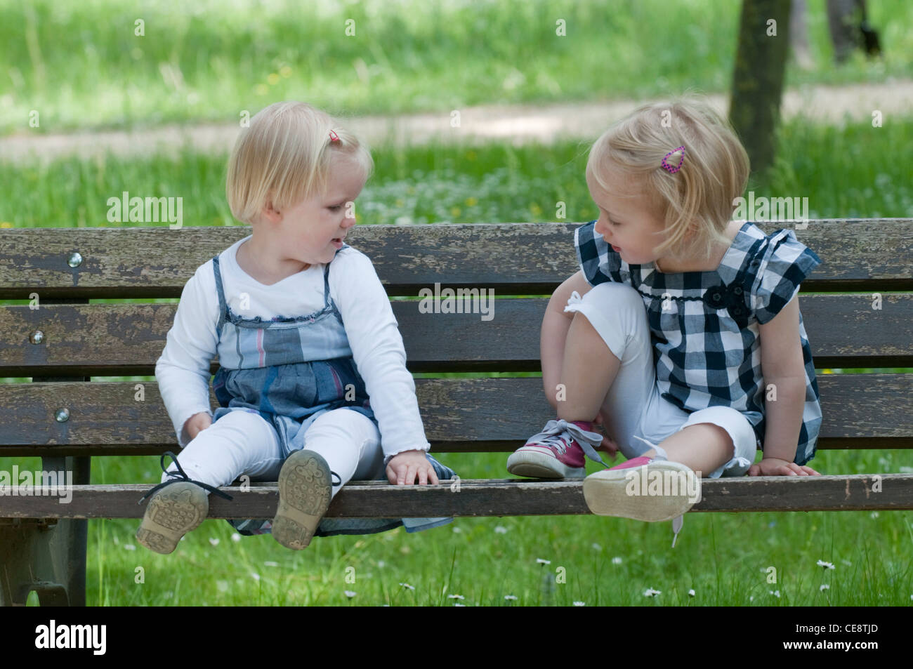 Two girls in park Stock Photo - Alamy