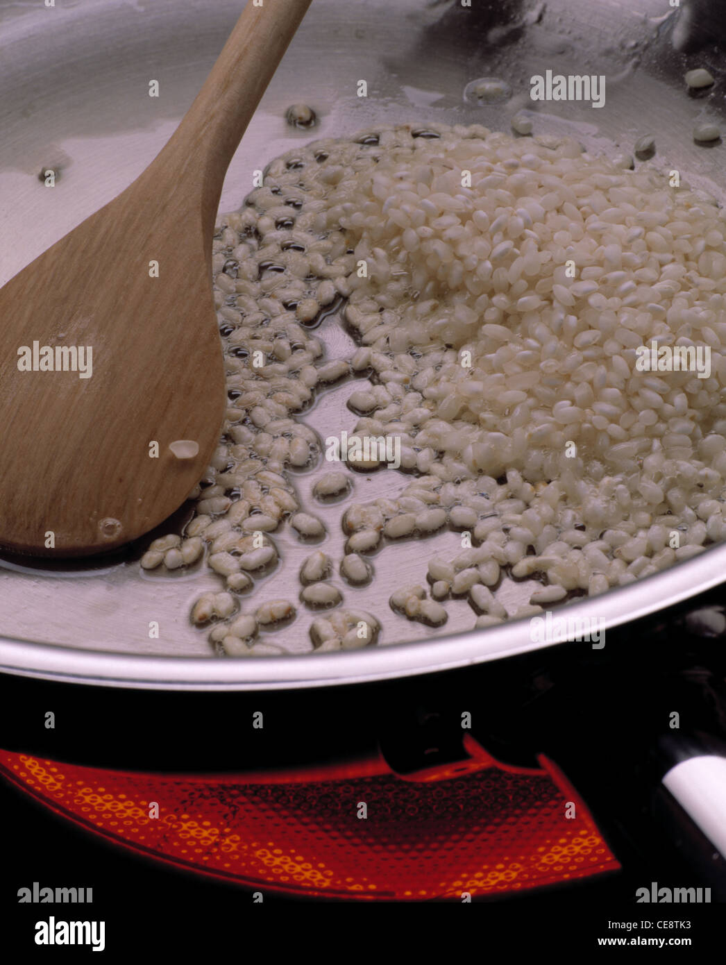 Steam risotto rice in hot oil till glassy hi-res stock photography and ...