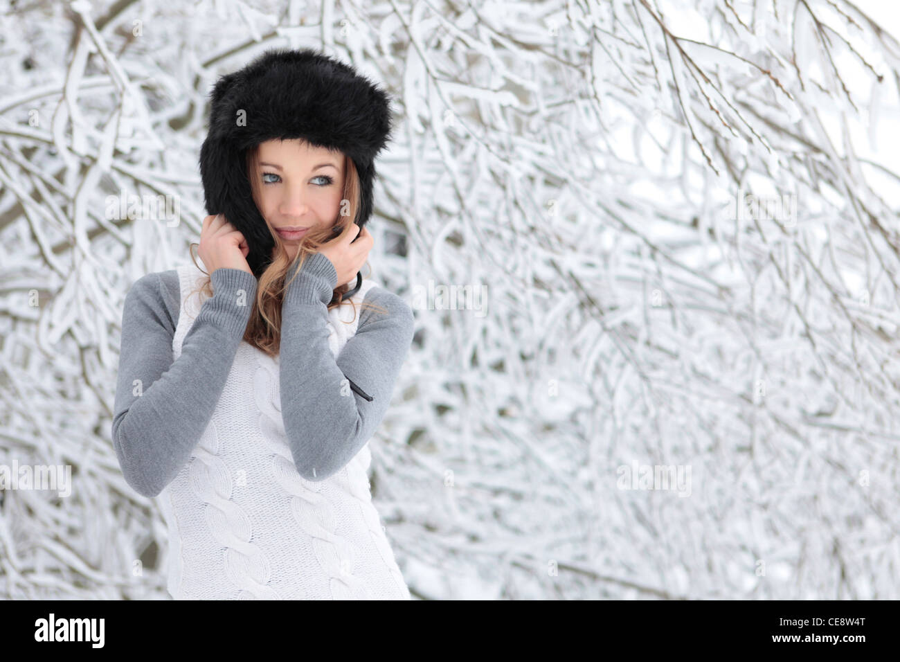 Young woman cap in snow Stock Photo - Alamy