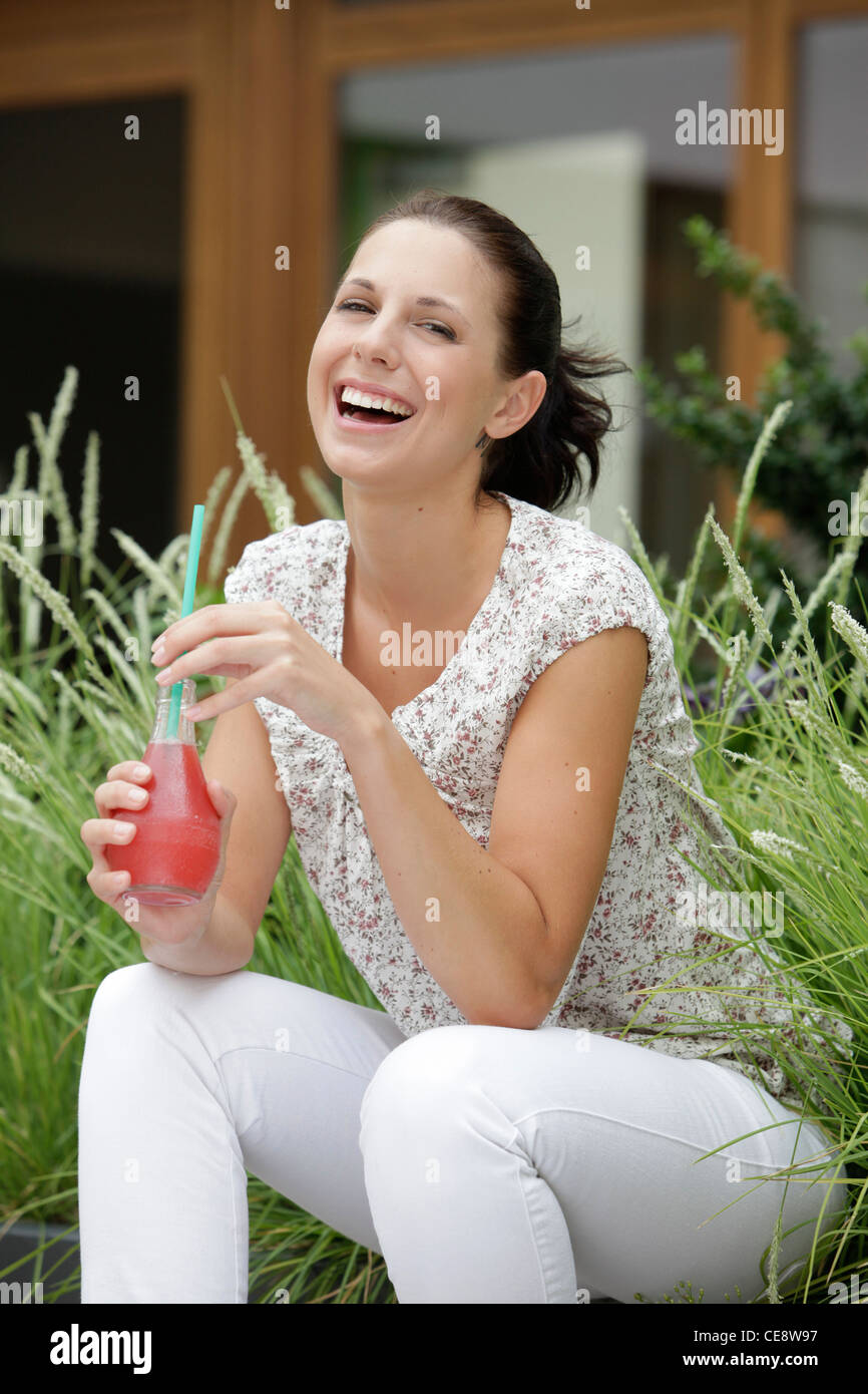 young woman drinking lemonade Stock Photo - Alamy