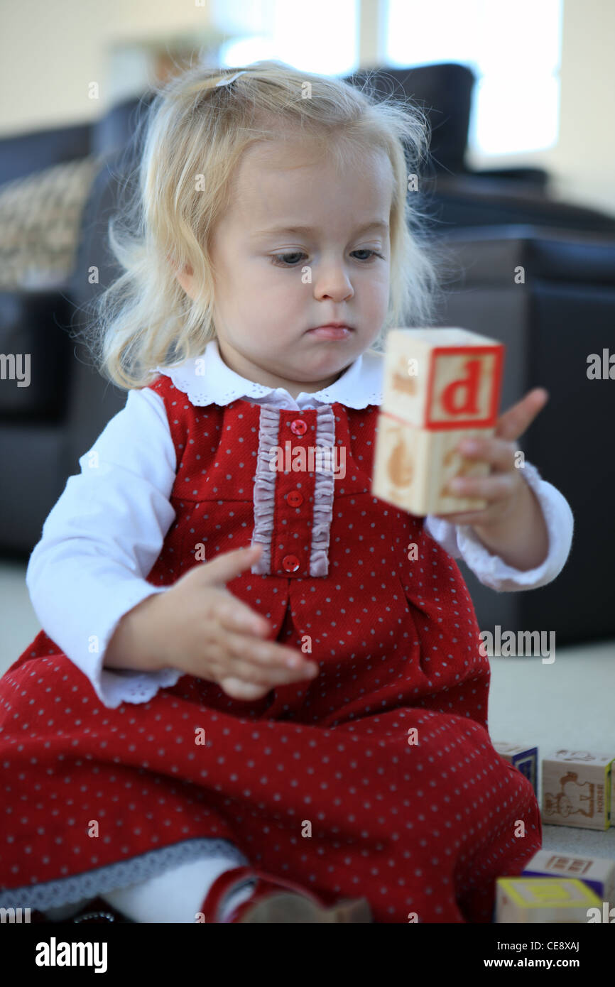 Toddler playing with building blocks Stock Photo - Alamy