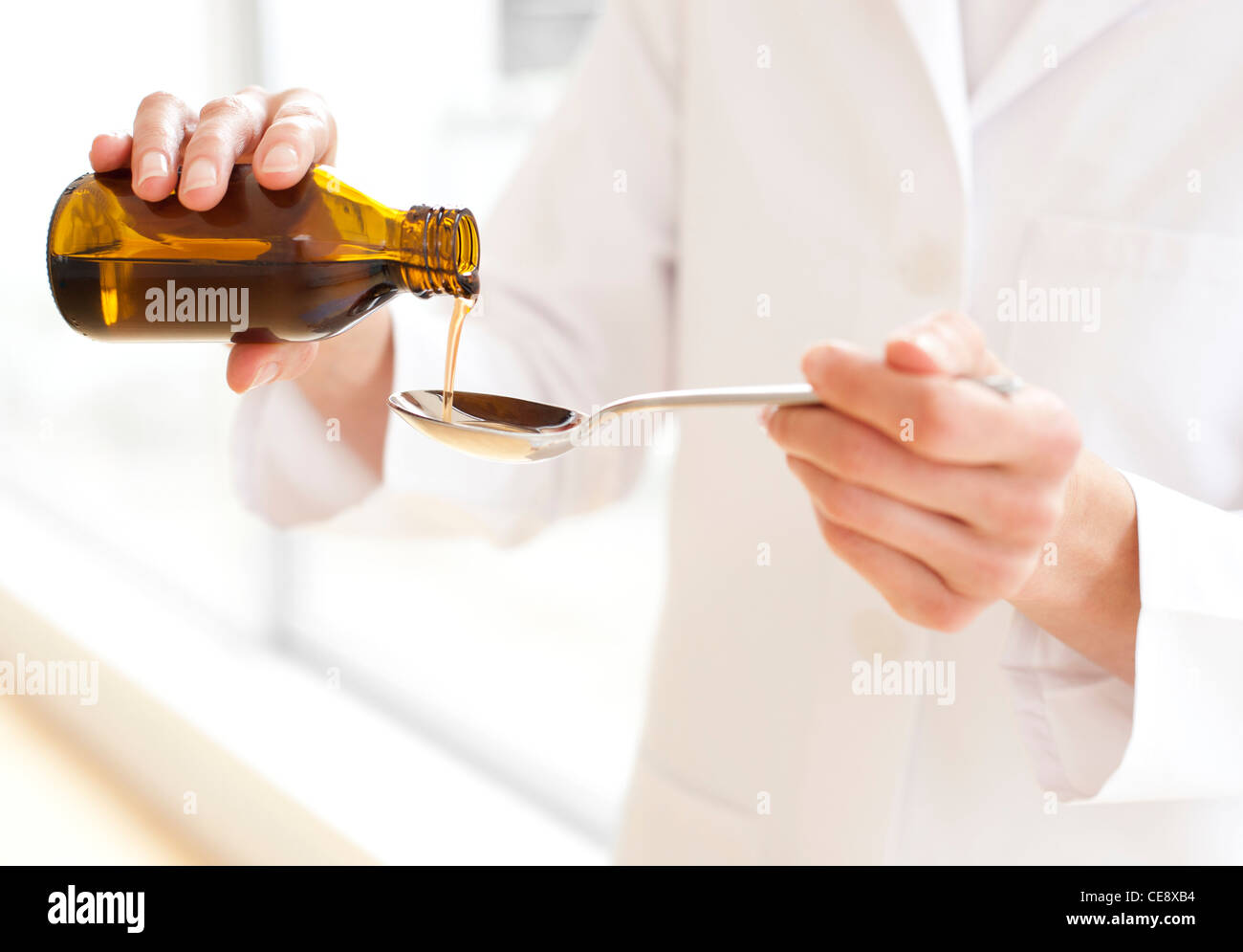 Dosage spoon with medicine bottle hi-res stock photography and images ...