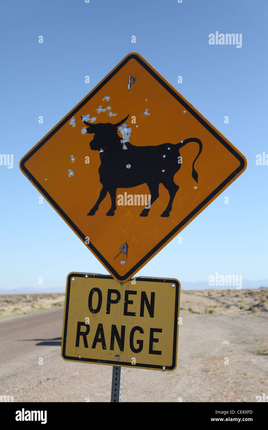 Shot up road sign in the Nevada desert Stock Photo - Alamy