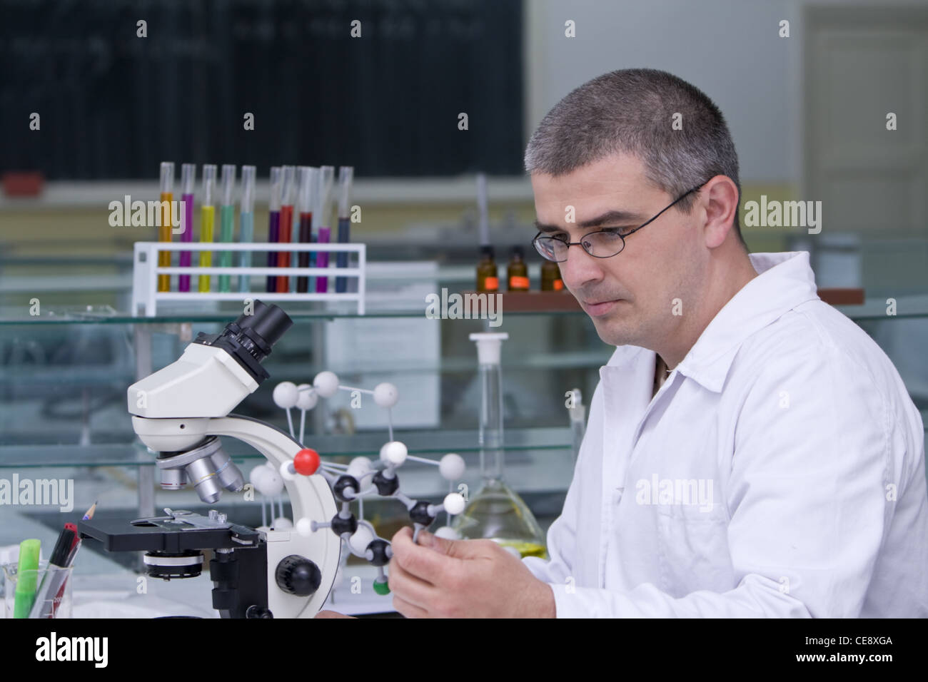 Researcher thinking about an experiment at his workplace Stock Photo ...