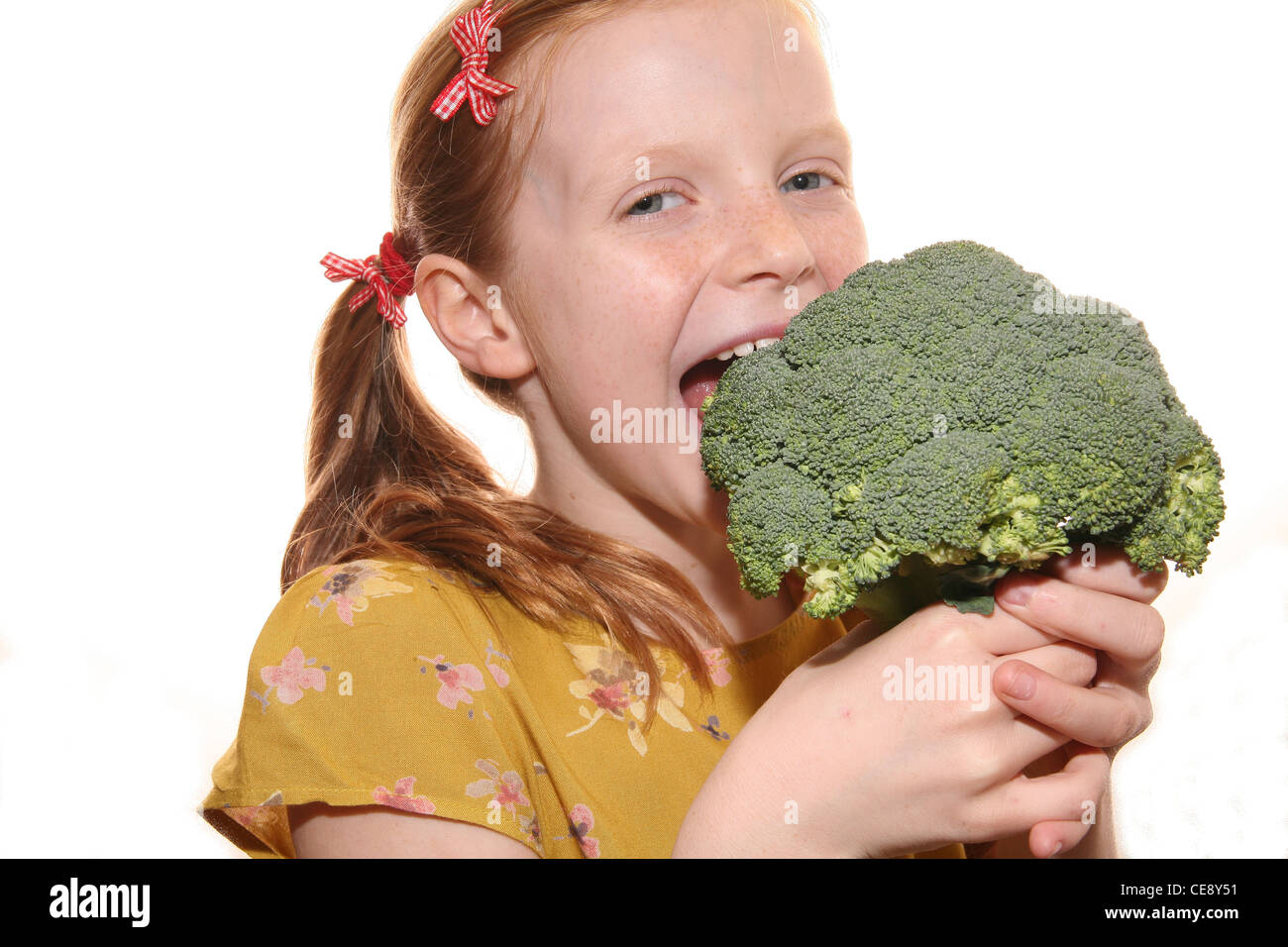 Child eating green snacks hi-res stock photography and images - Alamy