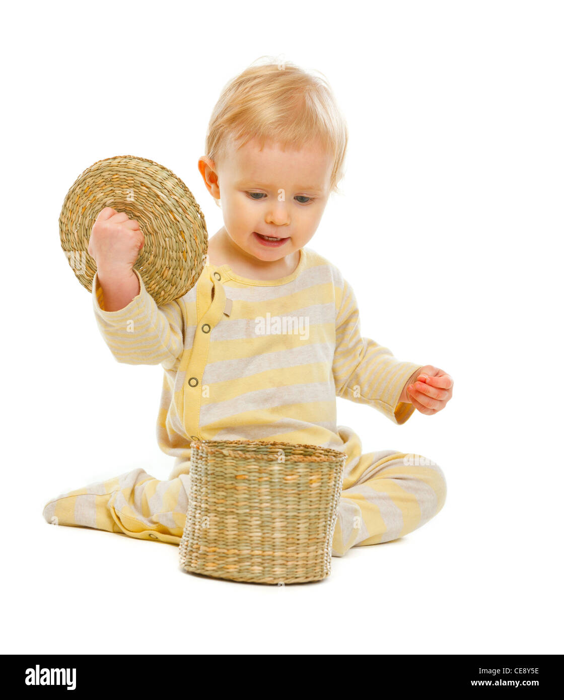 Interested baby looking inside of basket isolated on white Stock Photo ...