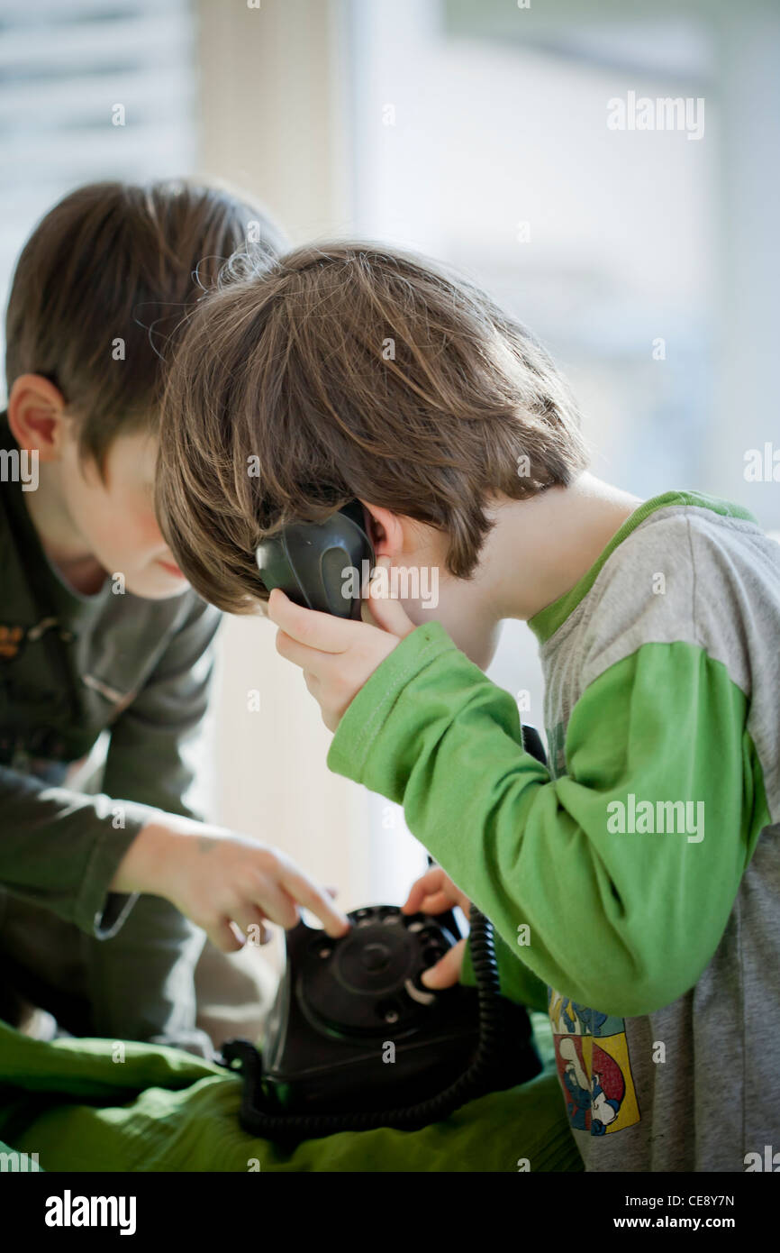 Boy using a retro telephone Stock Photo - Alamy