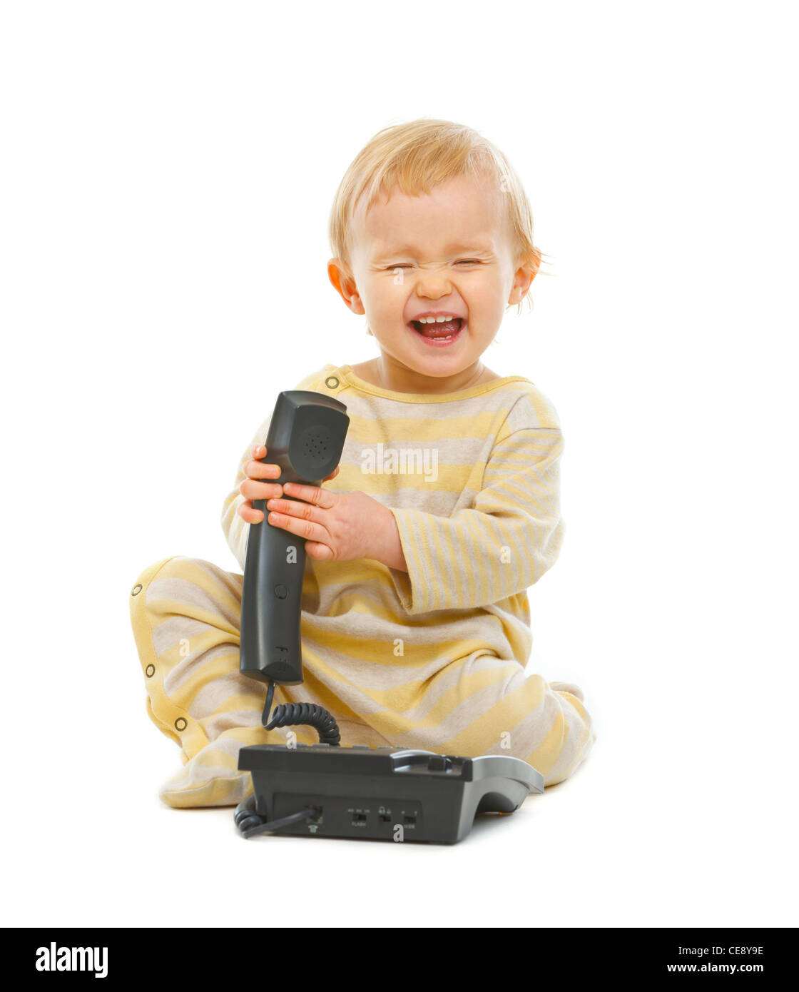 Laughing baby playing with phone isolated on white Stock Photo - Alamy