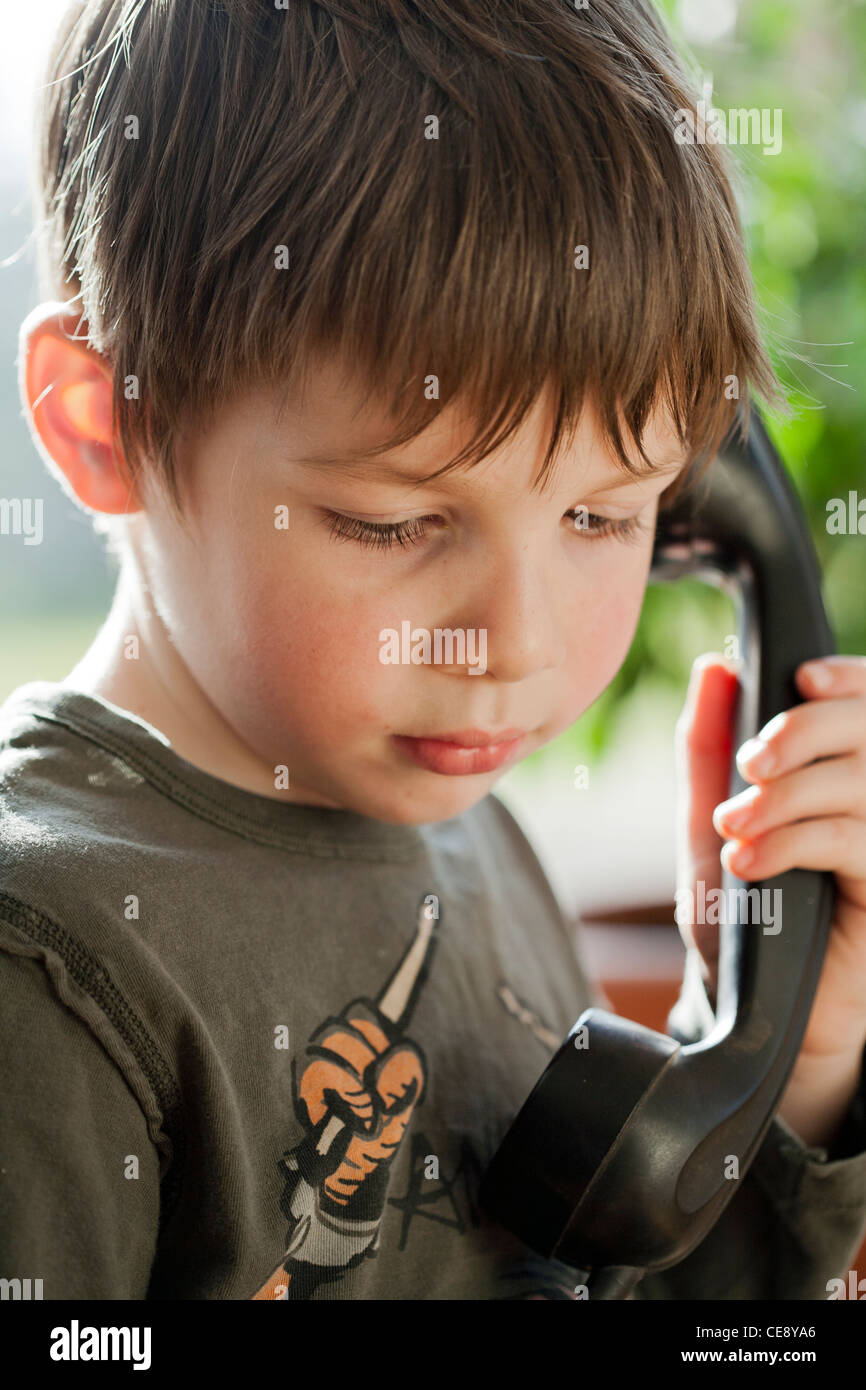 Boy using a retro telephone Stock Photo - Alamy