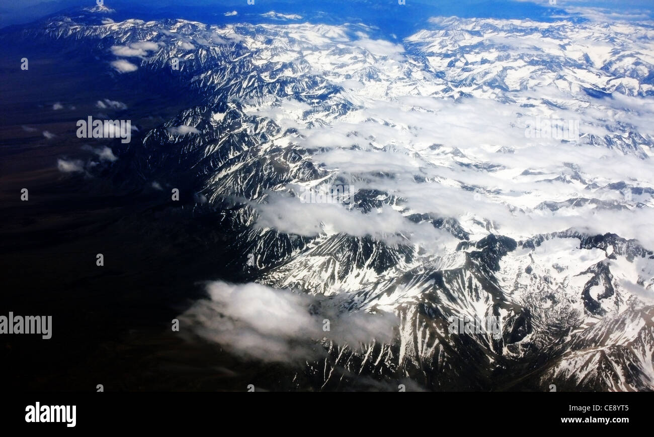 Mountains with snow - view from a plane Stock Photo - Alamy
